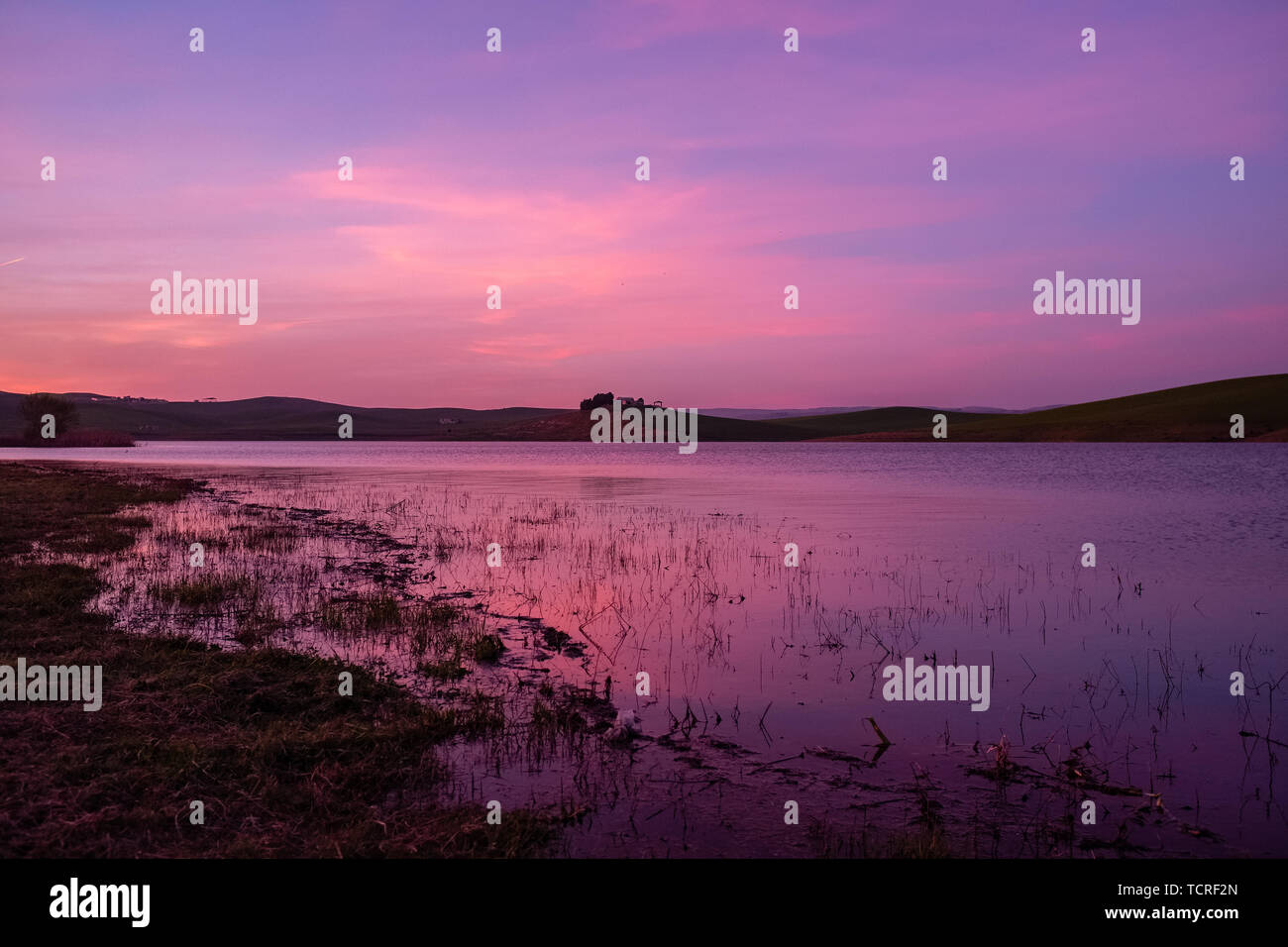 Sunset over the artificial lake of Serra del Corvo. Apulia and ...