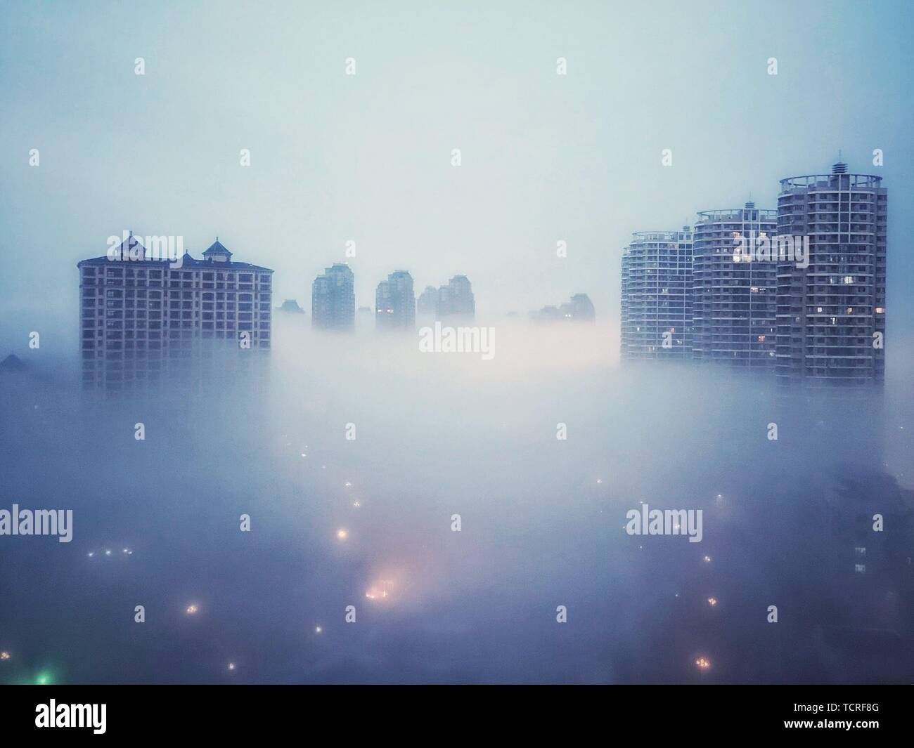 The city at night, foggy, overlooking view, buildings looming Stock ...