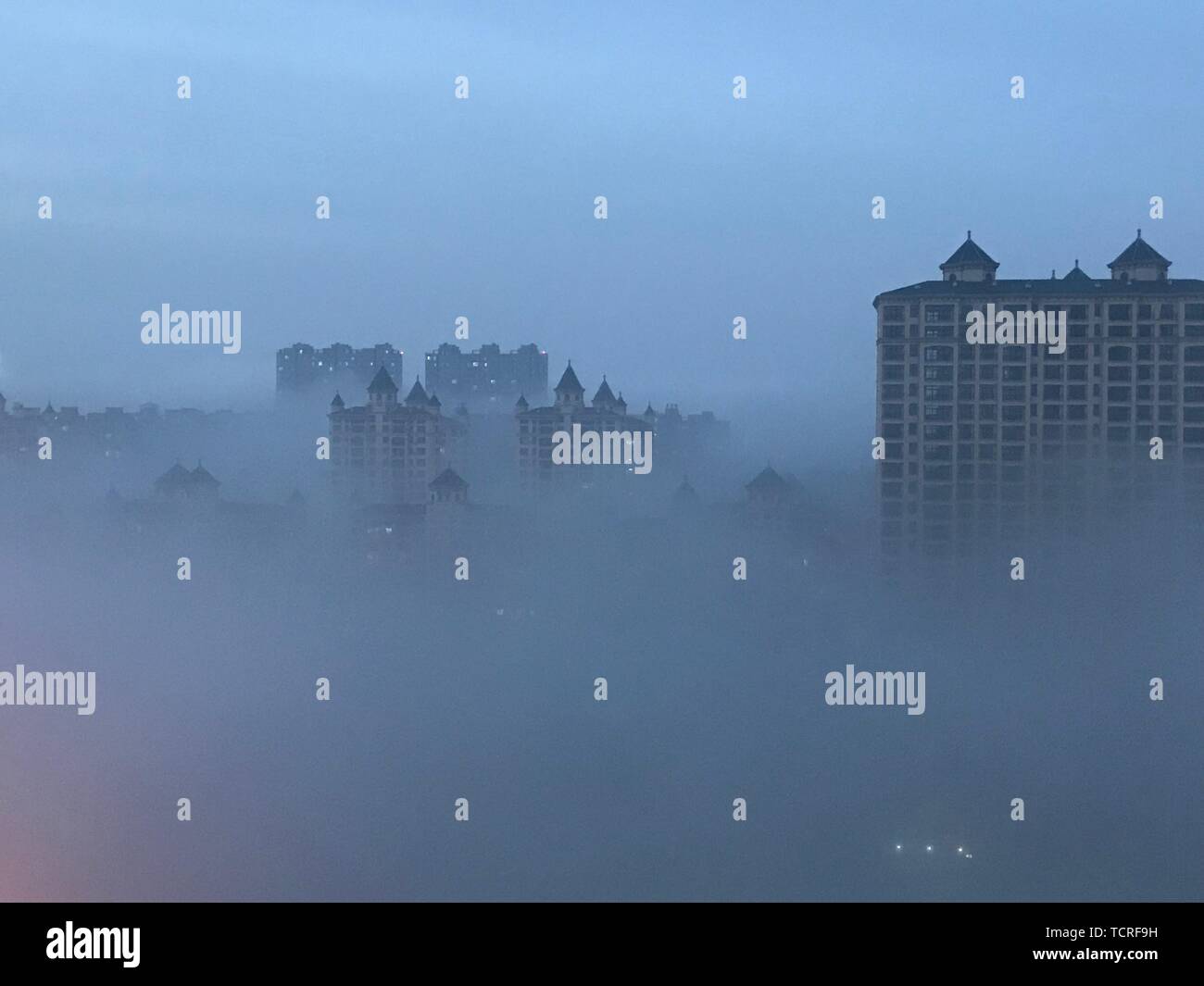 The city at night, foggy, overlooking view, buildings looming Stock ...