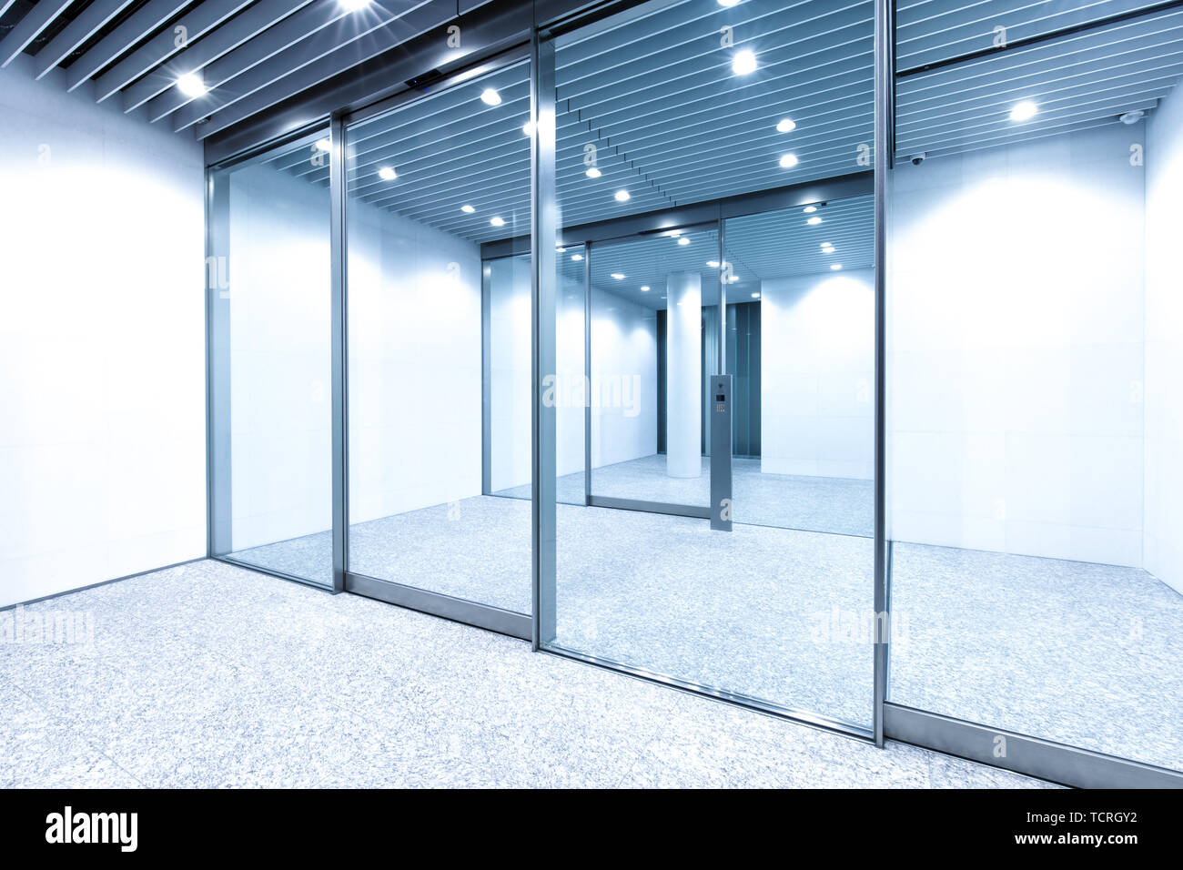 Glass wall in modern office building Stock Photo - Alamy