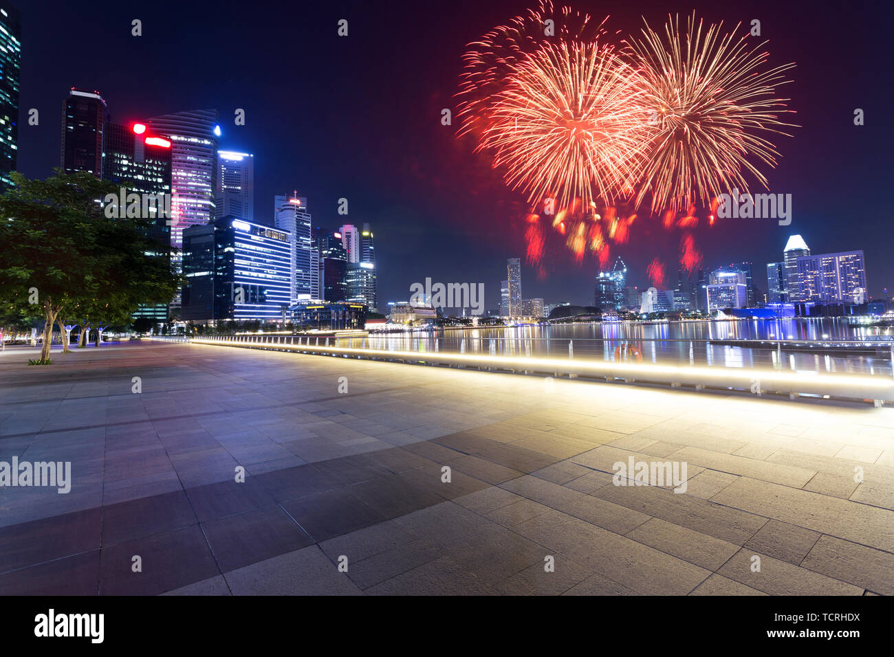 firework and night view of prosperous city Stock Photo - Alamy