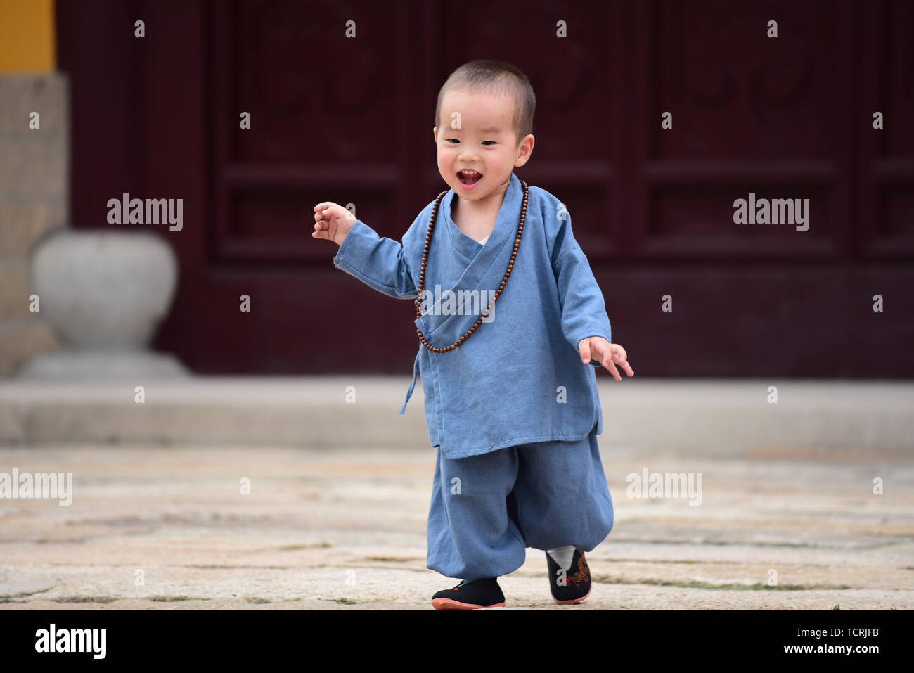 Cute little monk Stock Photo - Alamy