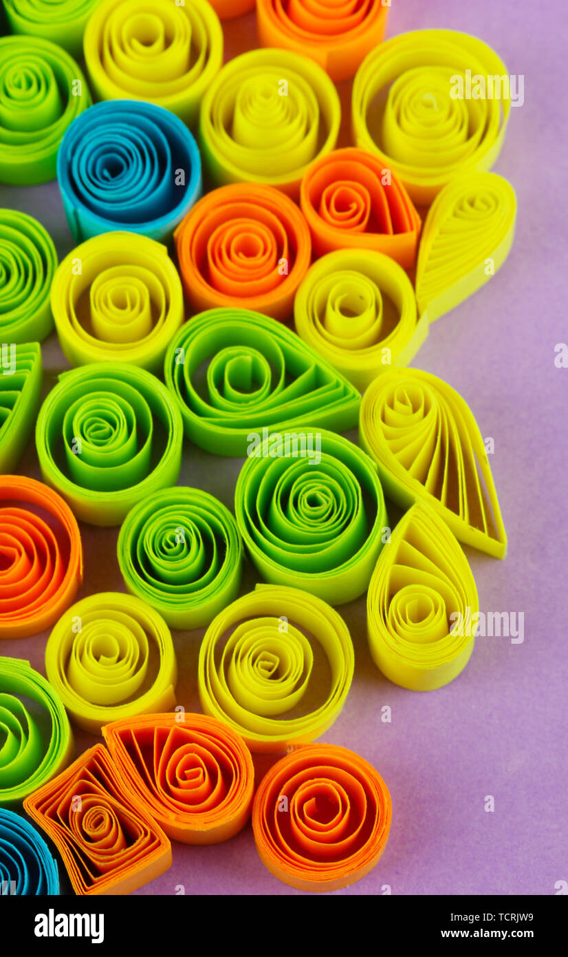 Colorful quilling on purple background close-up Stock Photo - Alamy