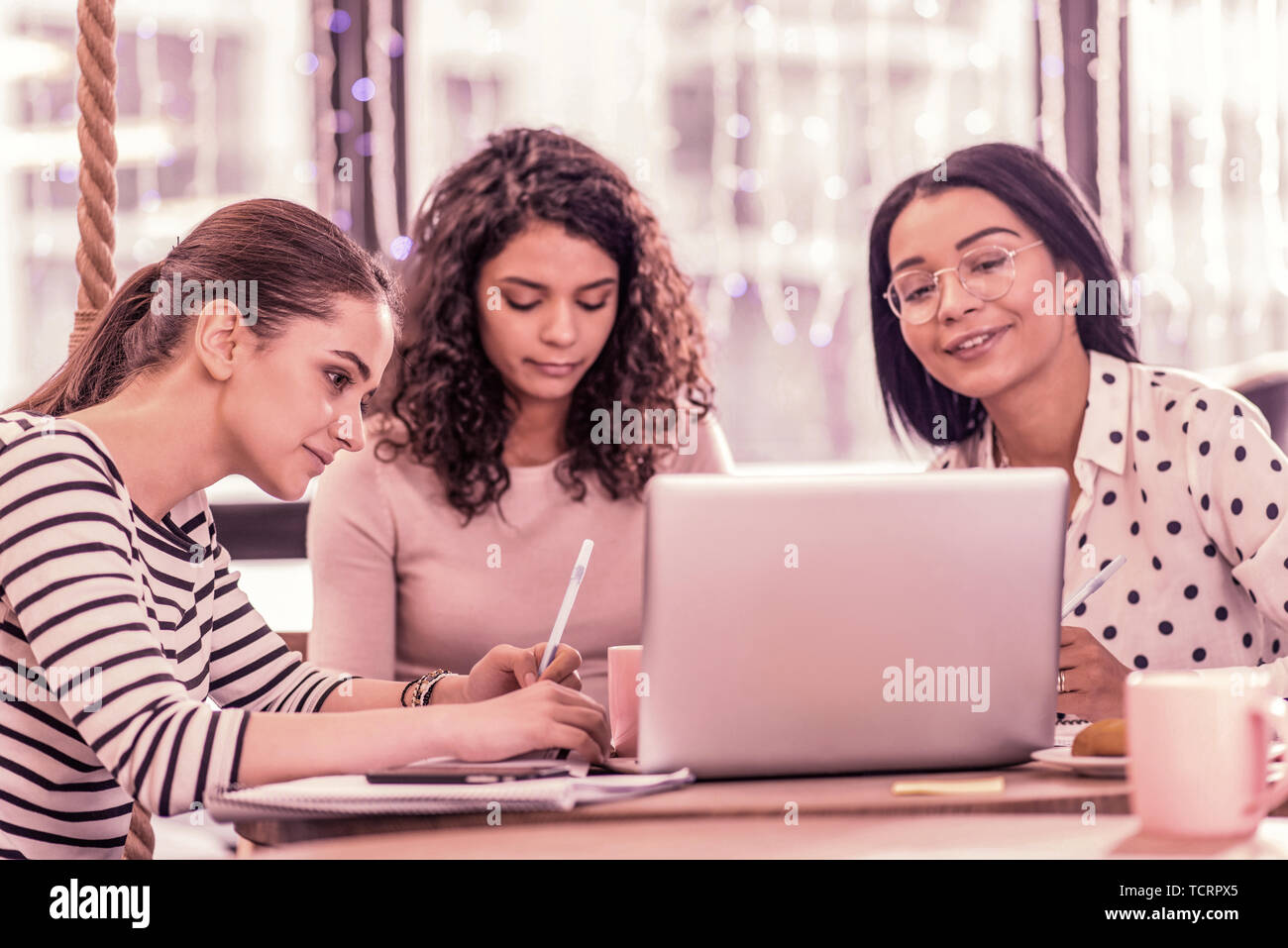 Three master students feeling busy while working on their project ...