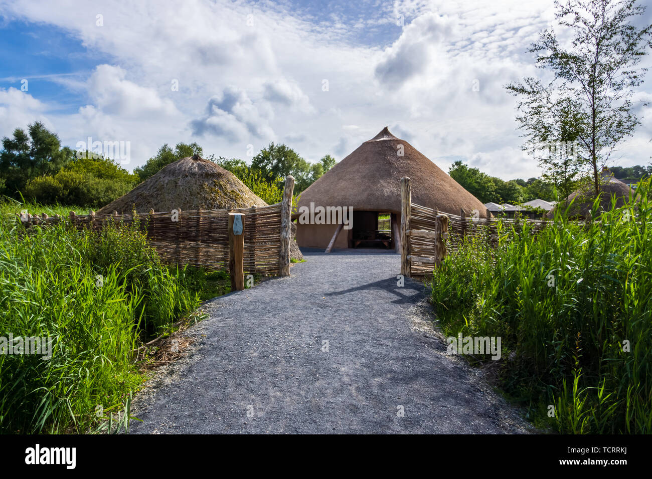Entrance trough gate to old thatch, straw Celtic cottage , concept of ...