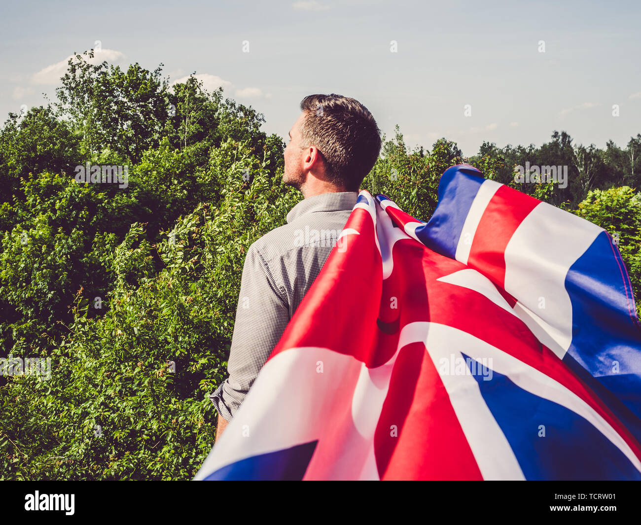 Man holding waving union jack flag hi-res stock photography and images ...