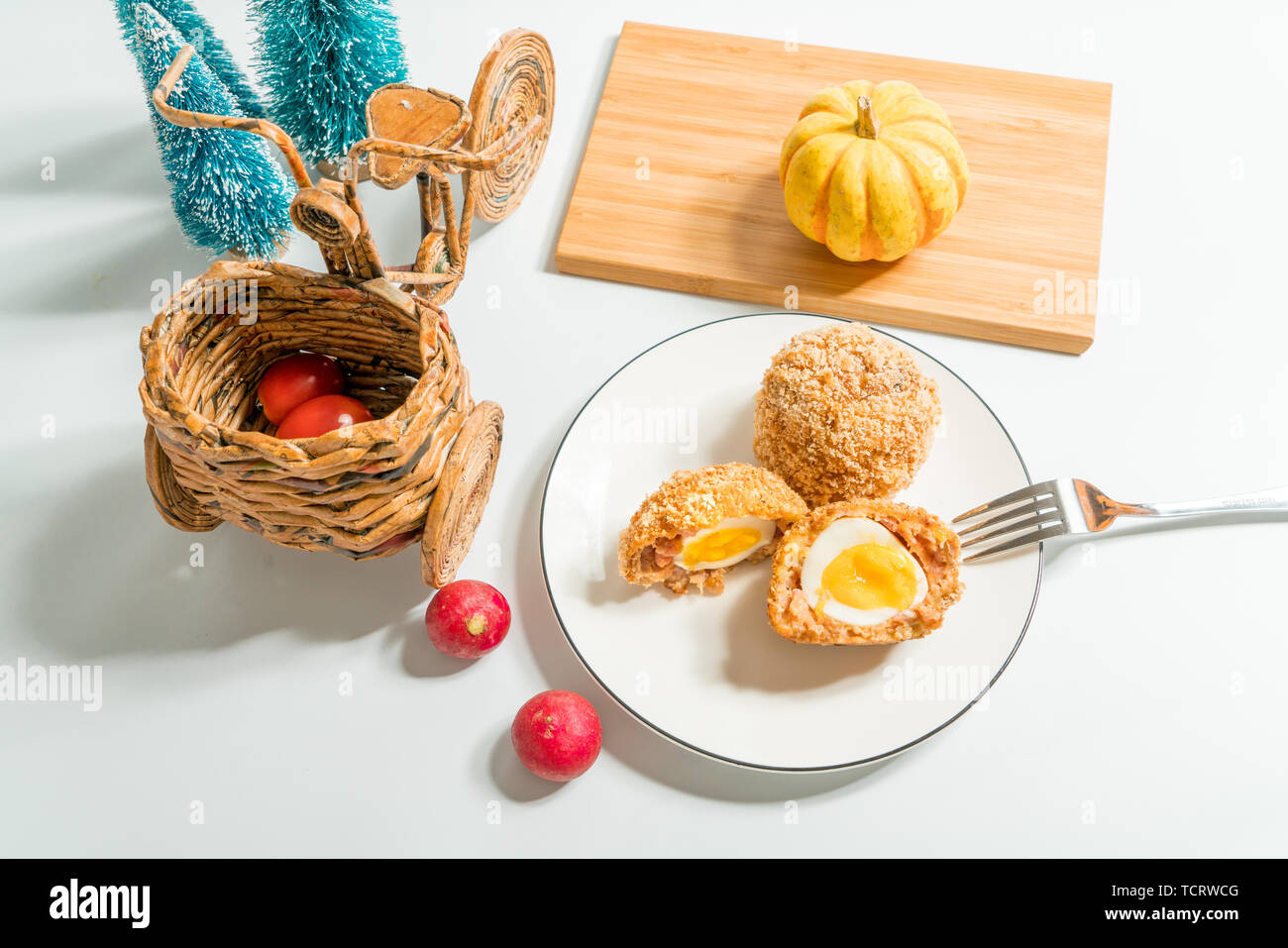 Scottish egg pendulum plate with white background Stock Photo - Alamy