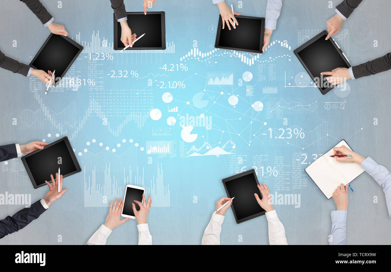 Group of people with devices in hands teamworking on laptops, tablets ...