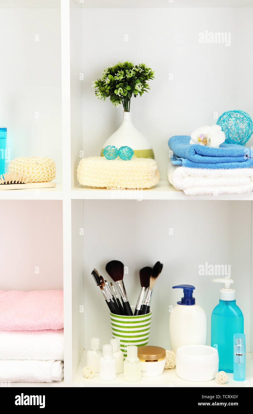 Bath accessories on shelfs in bathroom Stock Photo - Alamy