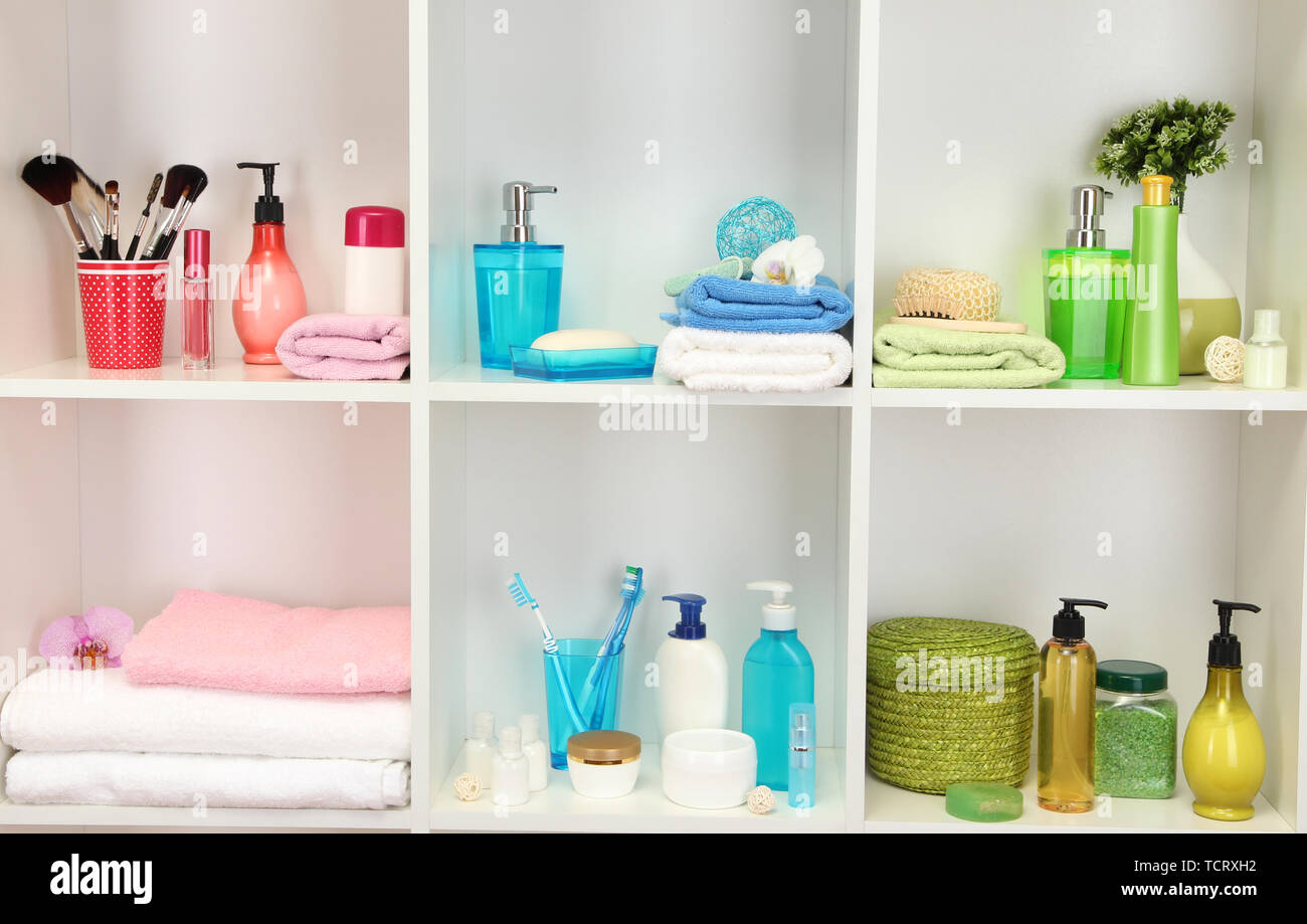 Bath accessories on shelfs in bathroom Stock Photo - Alamy