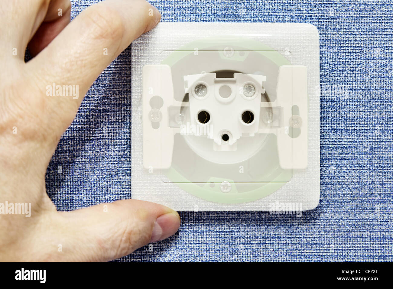 View of the internal module of a household electrical socket through ...