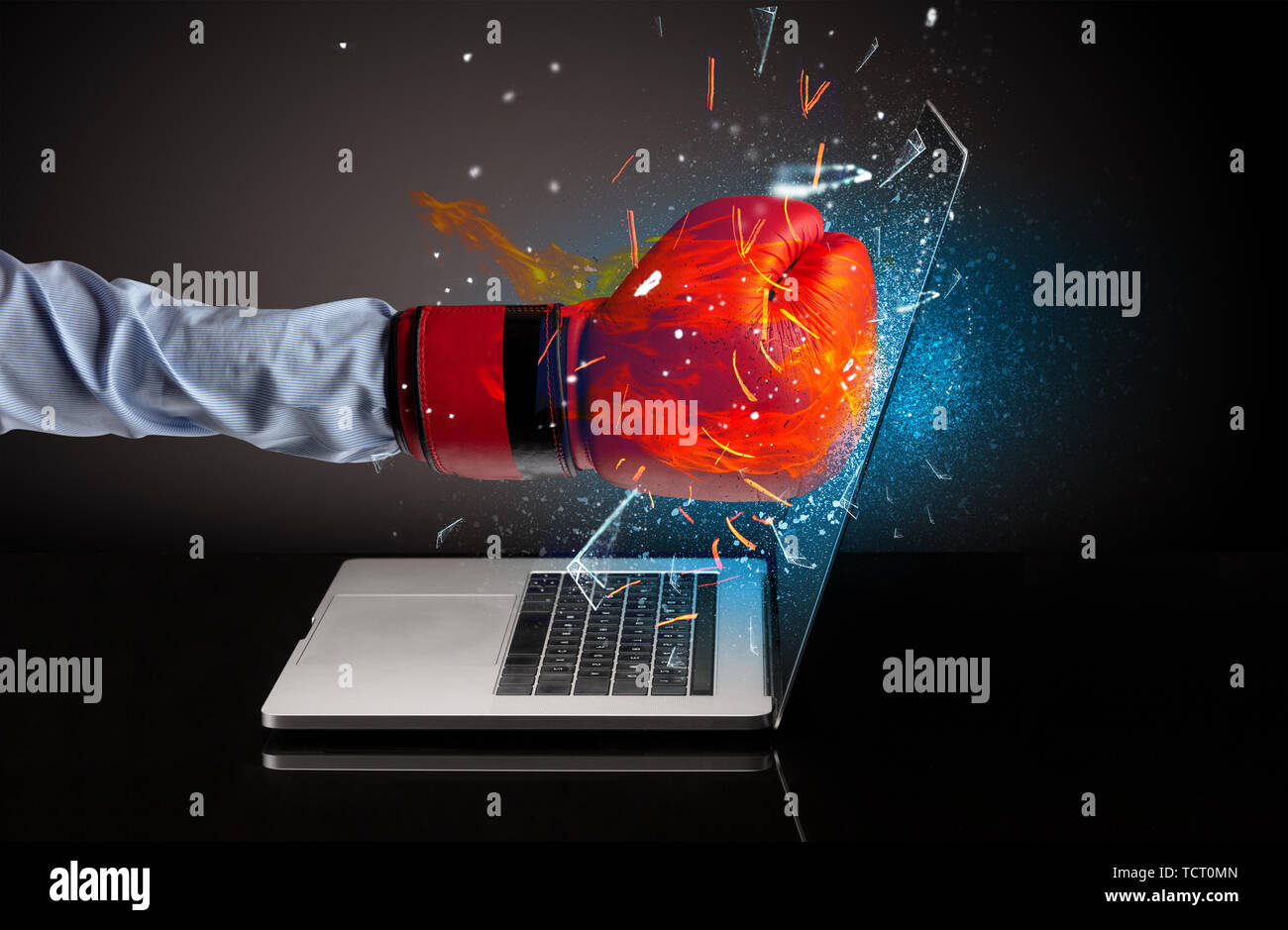 Firing hand hitting strongly laptop screen glass Stock Photo - Alamy