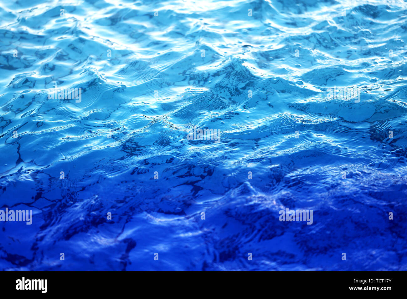 Macro photo background with transparent blue waves of sea water ...