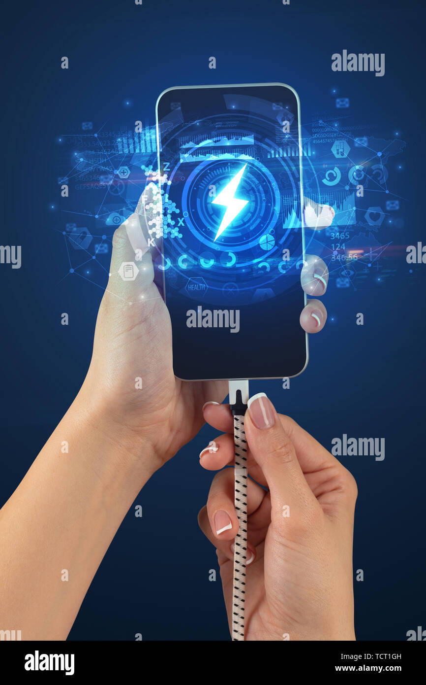 Elegant hand charging smartphone with global report concept Stock Photo ...