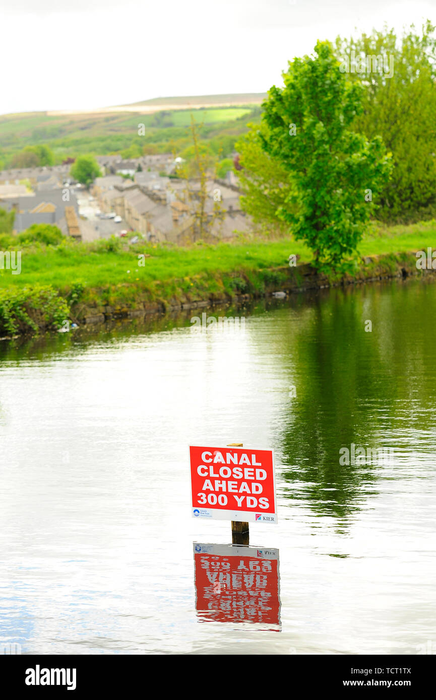 Canal closed sign in the middle of the Leeds Liverpool canal at Burnley ...