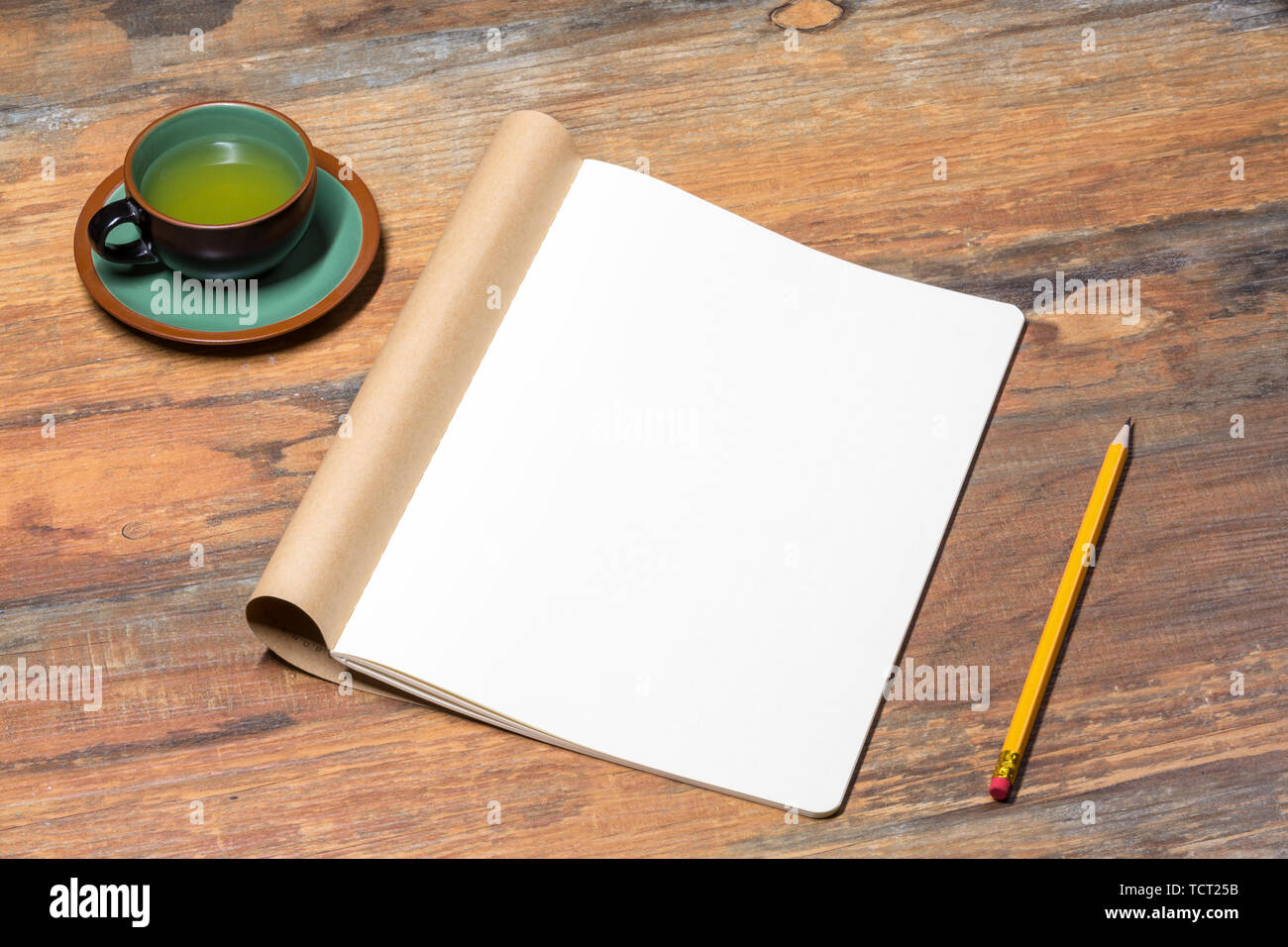 Blank notebook on your desk Stock Photo - Alamy