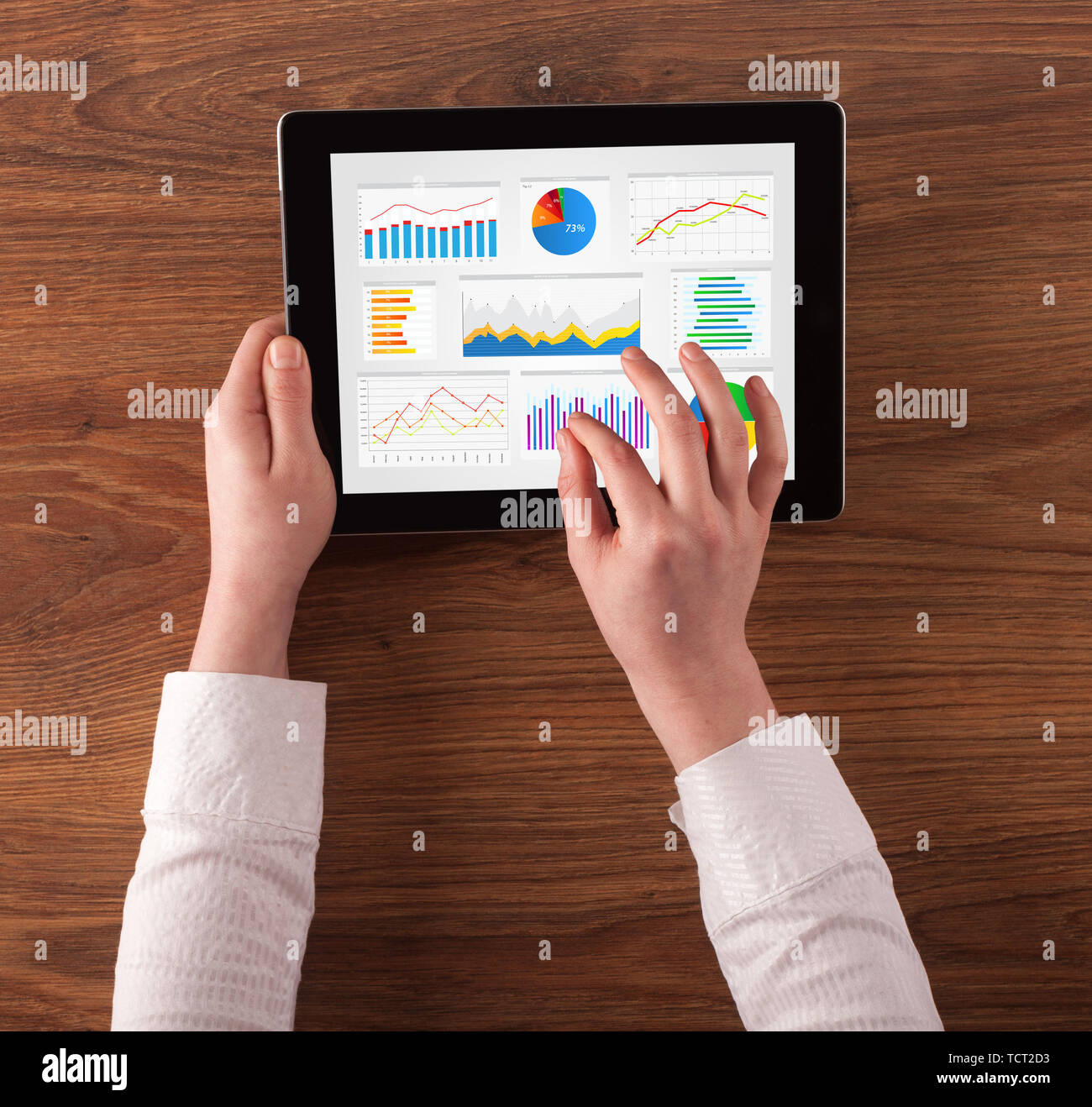 Hand making diagrams and charts on tablet Stock Photo - Alamy