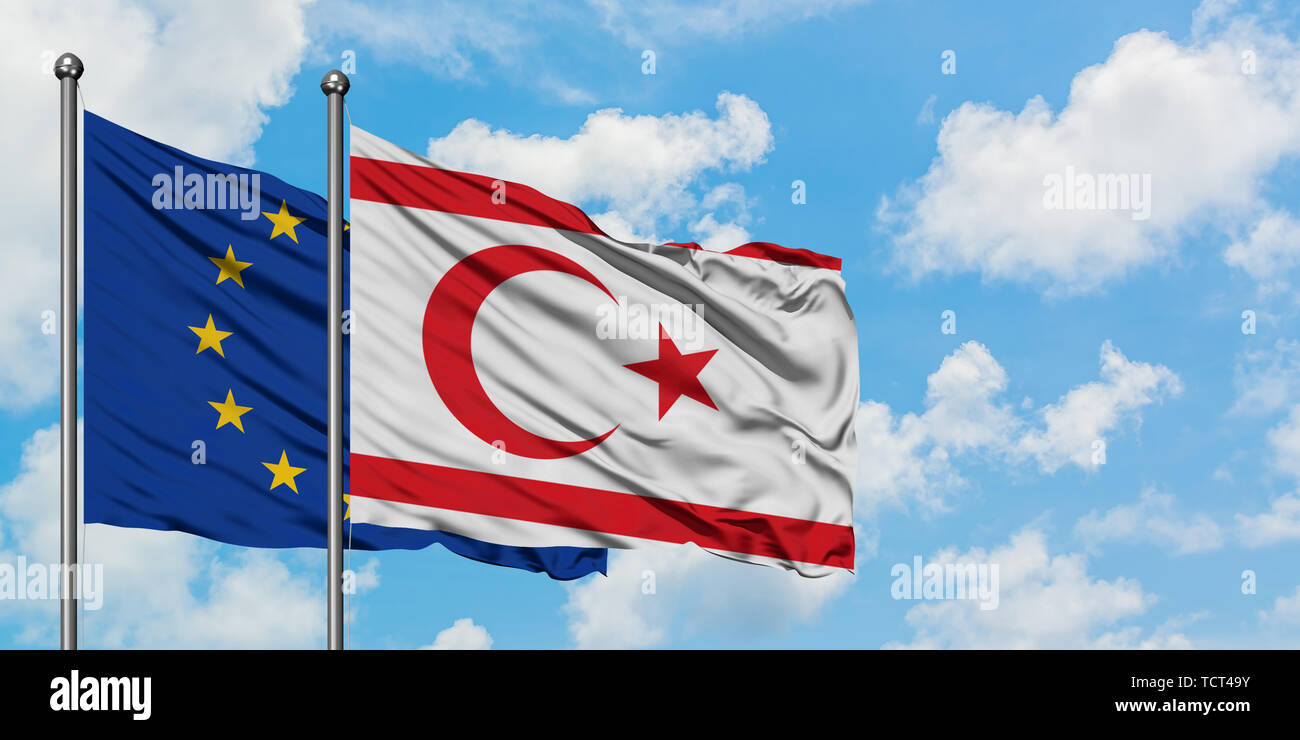 European Union and Northern Cyprus flag waving in the wind against ...