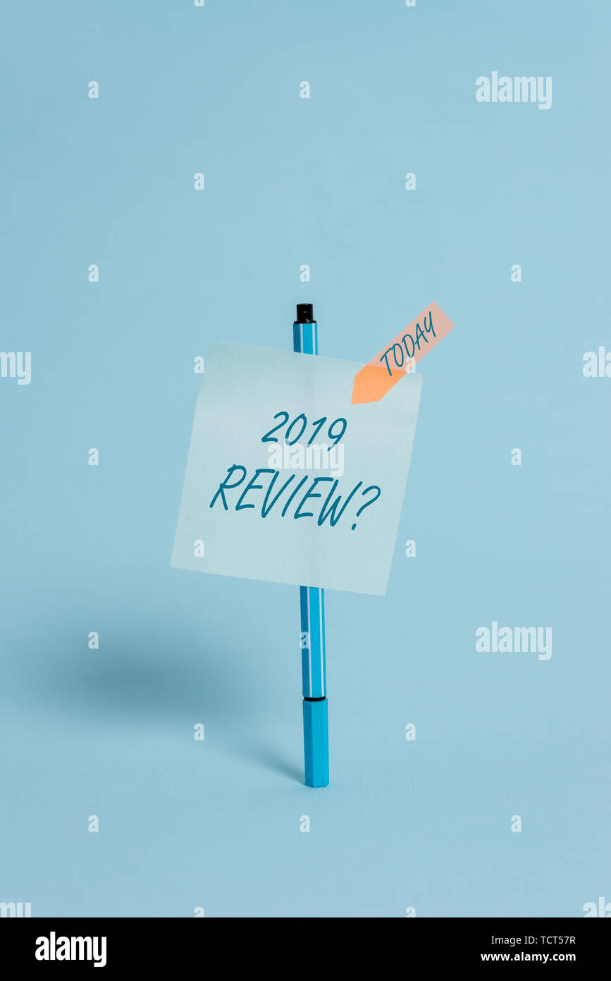 Writing note showing 2019 Review Question. Business concept for ...