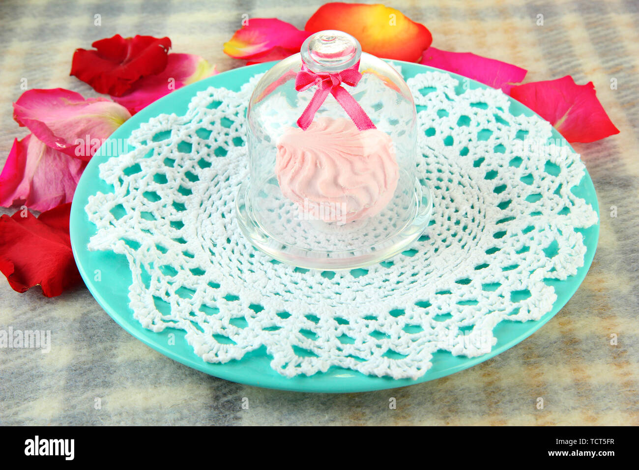 Marshmallows on saucer with transparent cover on light background Stock ...