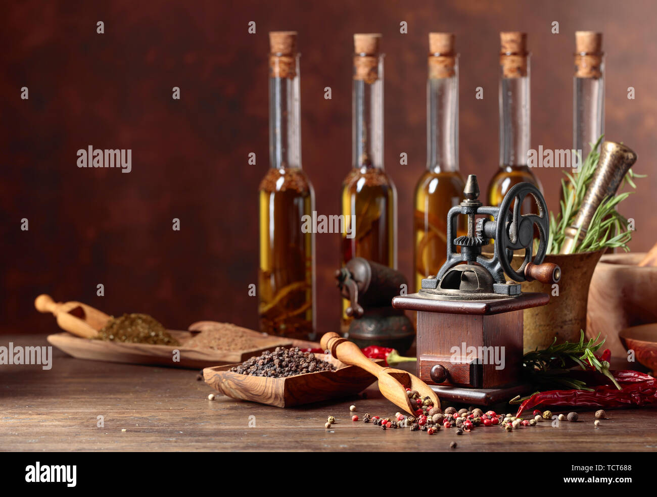 Vintage pepper mill with various peppers and spices. Old pepper mill ...