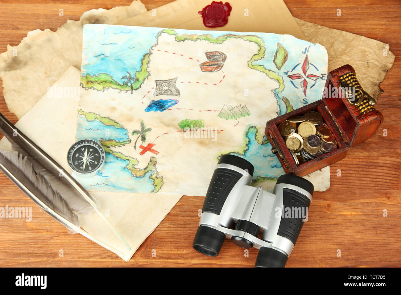 map of treasures on wooden background Stock Photo - Alamy