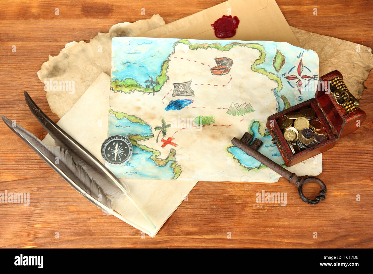 map of treasures on wooden background Stock Photo - Alamy