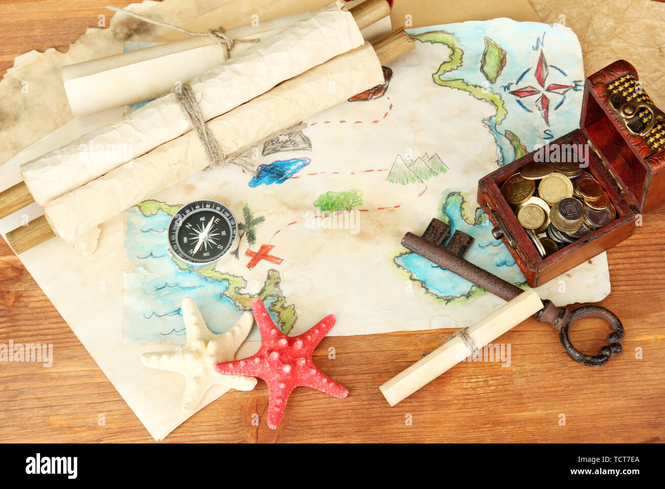 map of treasures on wooden background Stock Photo - Alamy