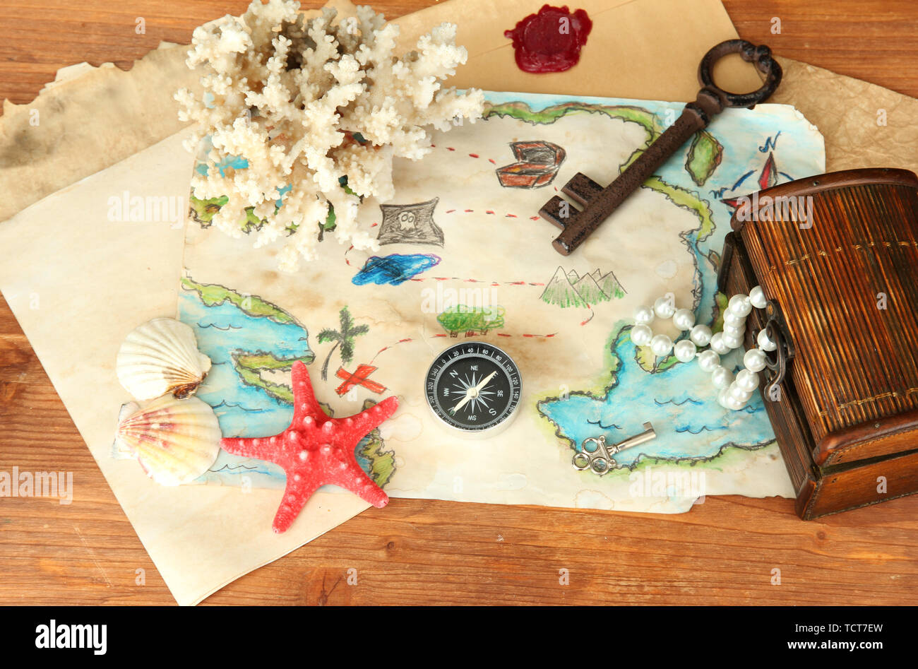 map of treasures on wooden background Stock Photo - Alamy