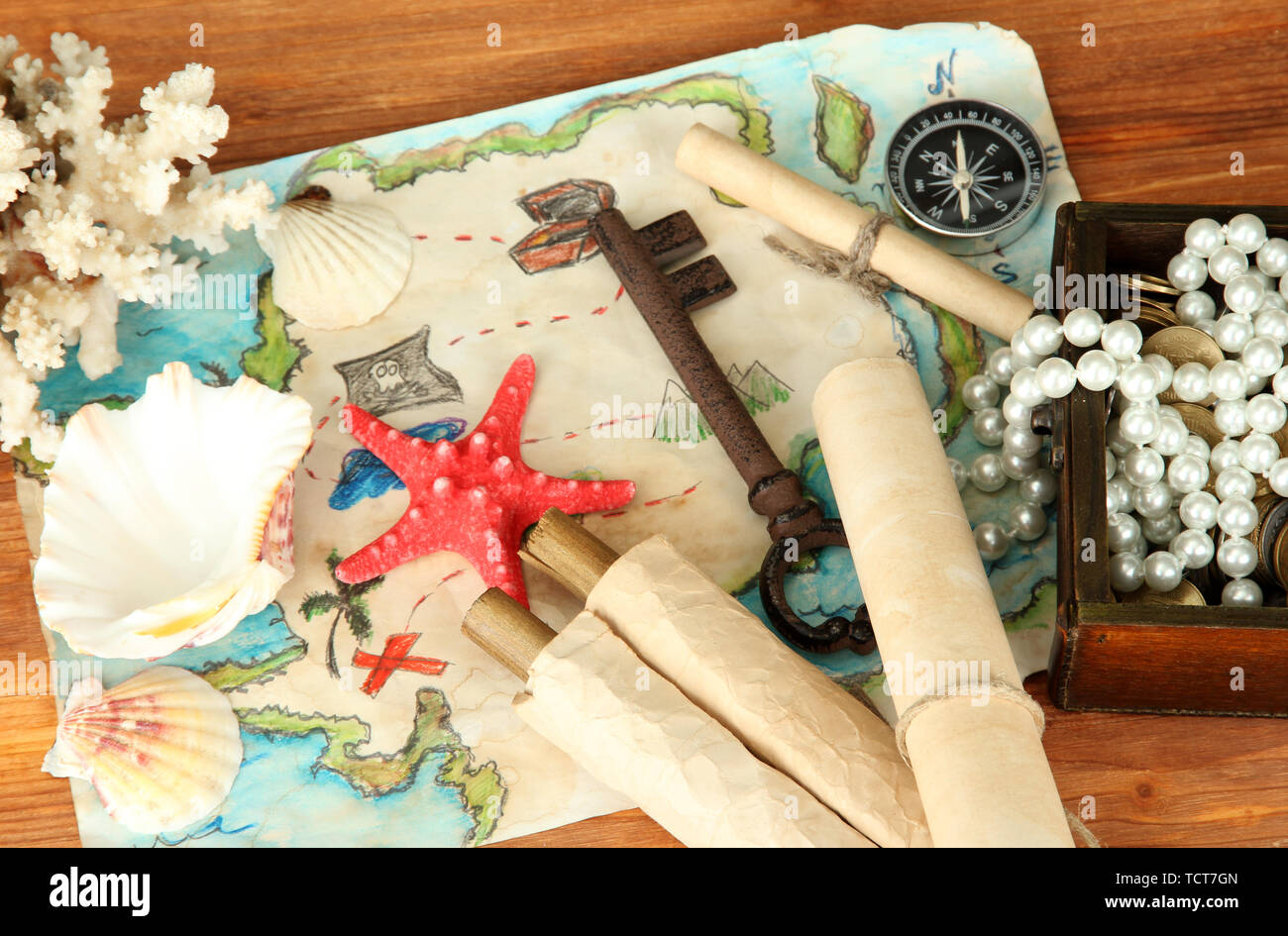 map of treasures on wooden background Stock Photo - Alamy