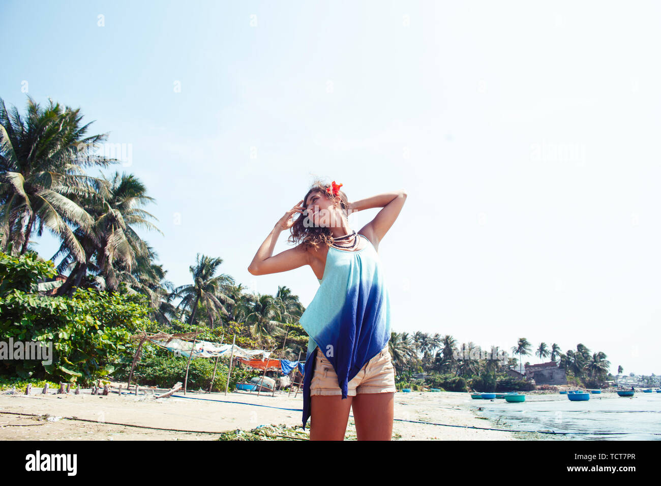 cute smiling young real woman in asian country sea port, vietnam ...