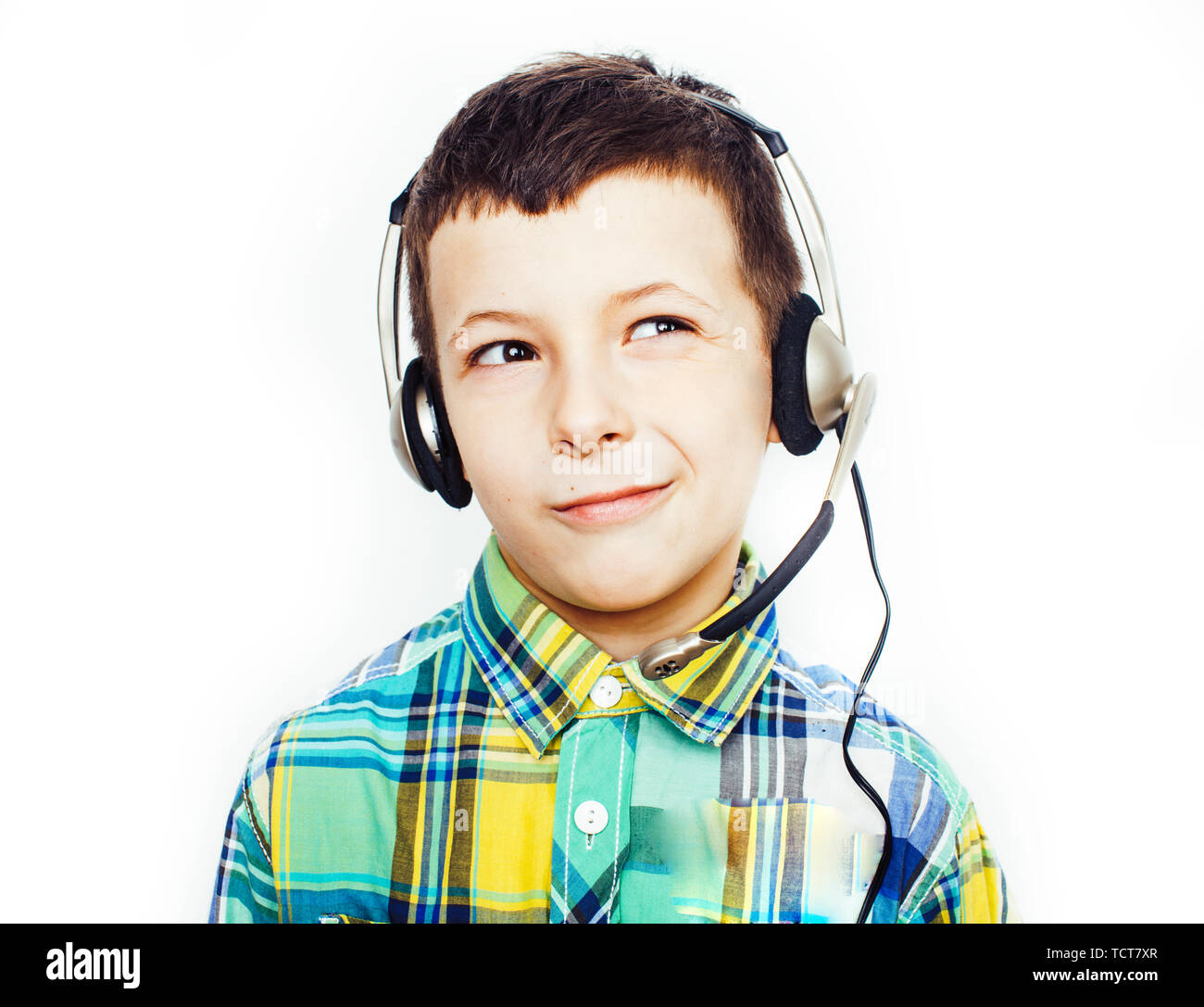 little cute caucasian boy in headphones posing happy smiling isolated ...