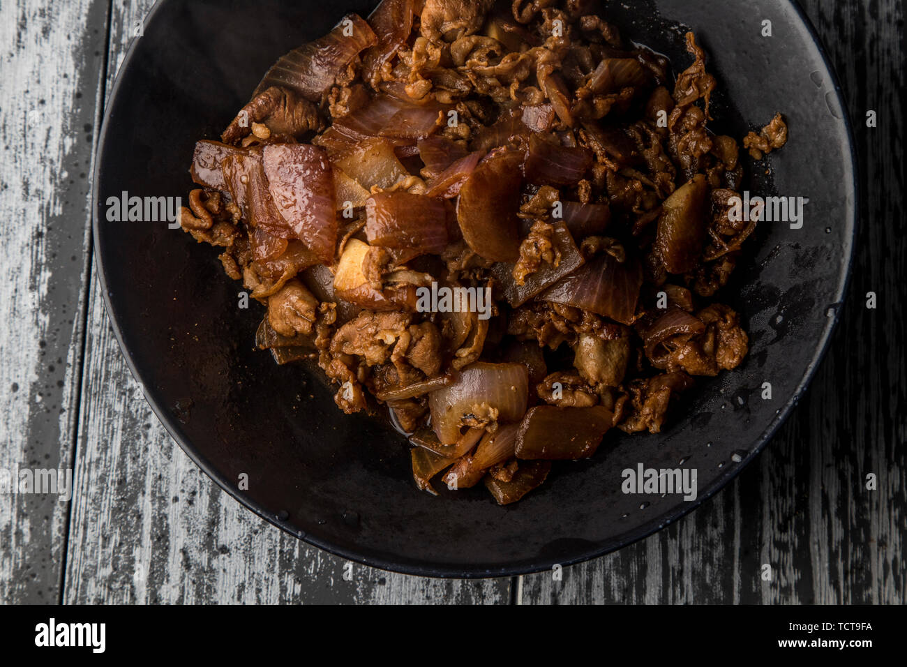Onion fried meat Stock Photo - Alamy