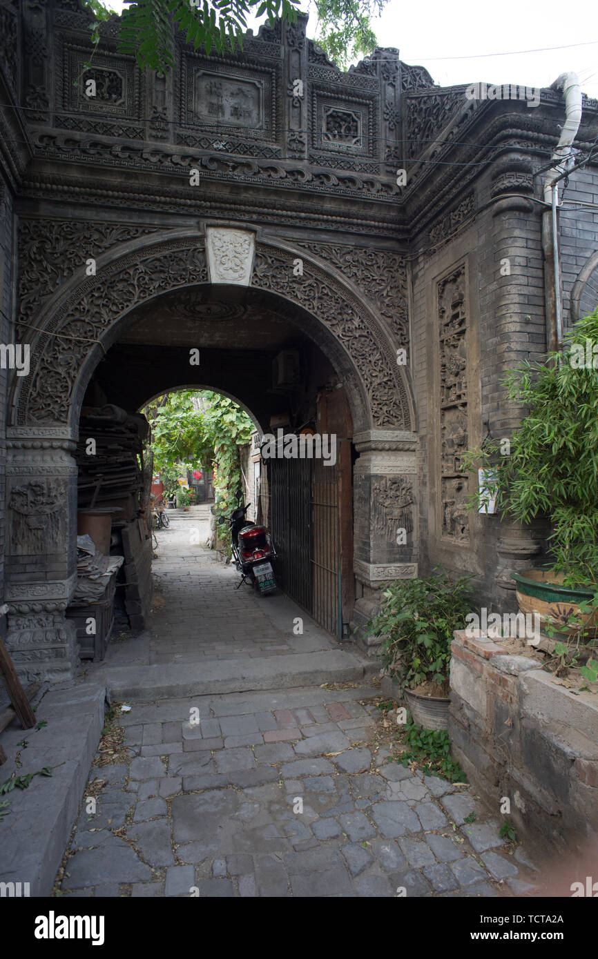 A brick-carved door building in Beijing Hutong Stock Photo - Alamy