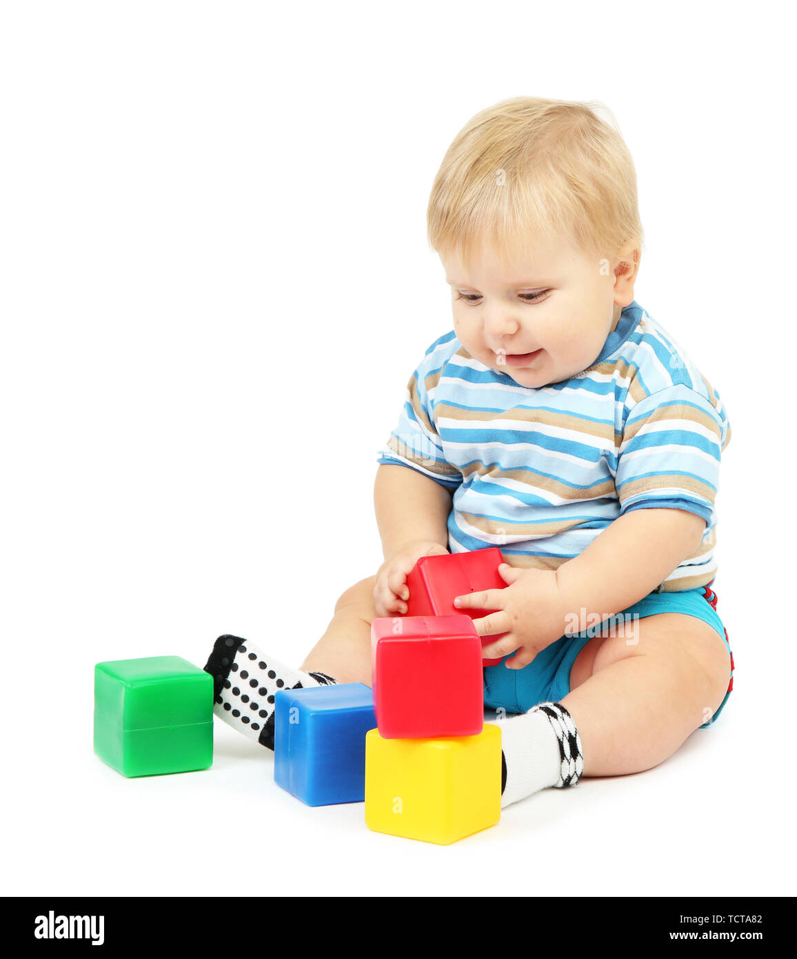 Little boy playing with multicolor blocks Stock Photo - Alamy