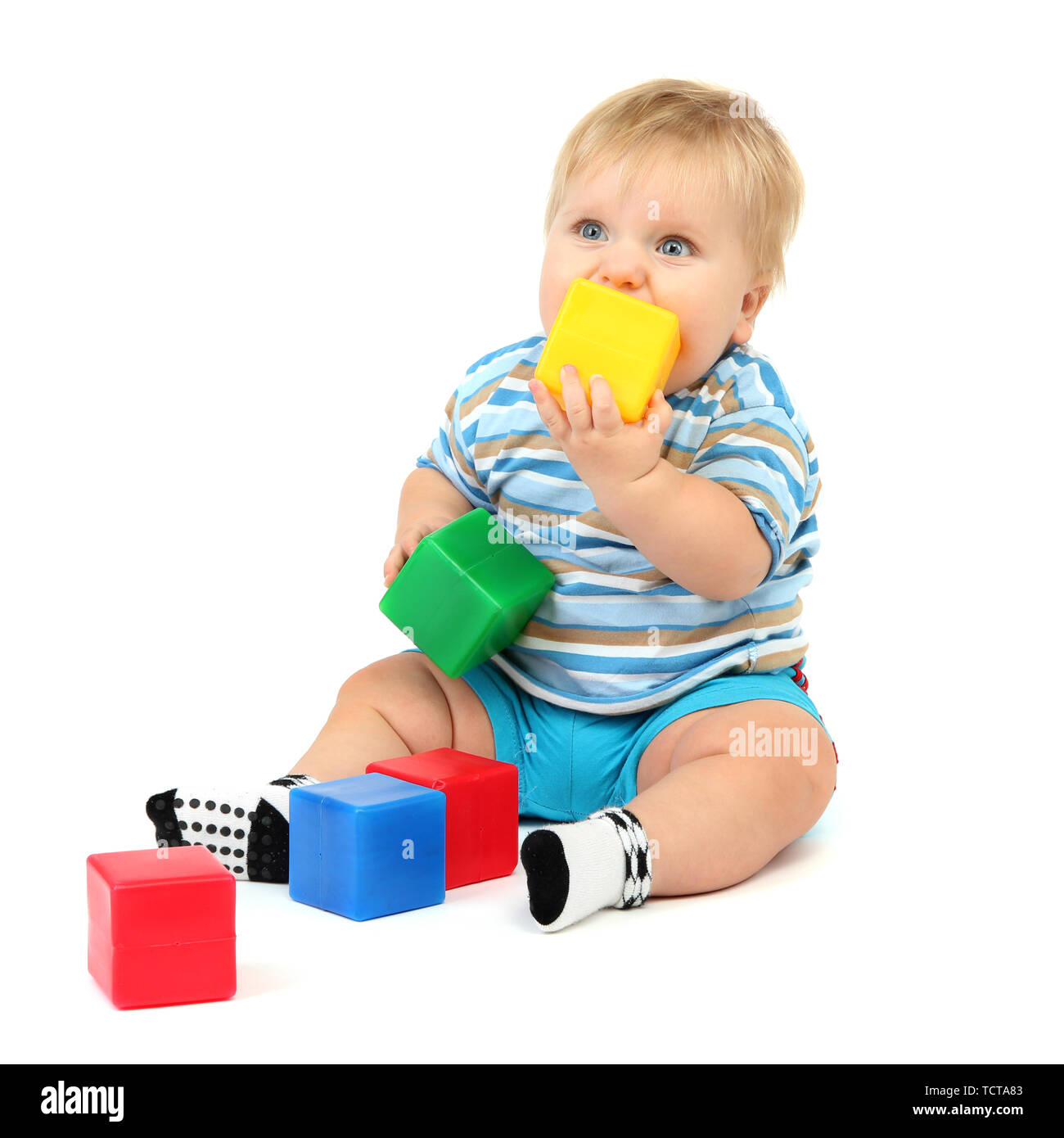 Little boy playing with multicolor blocks Stock Photo - Alamy