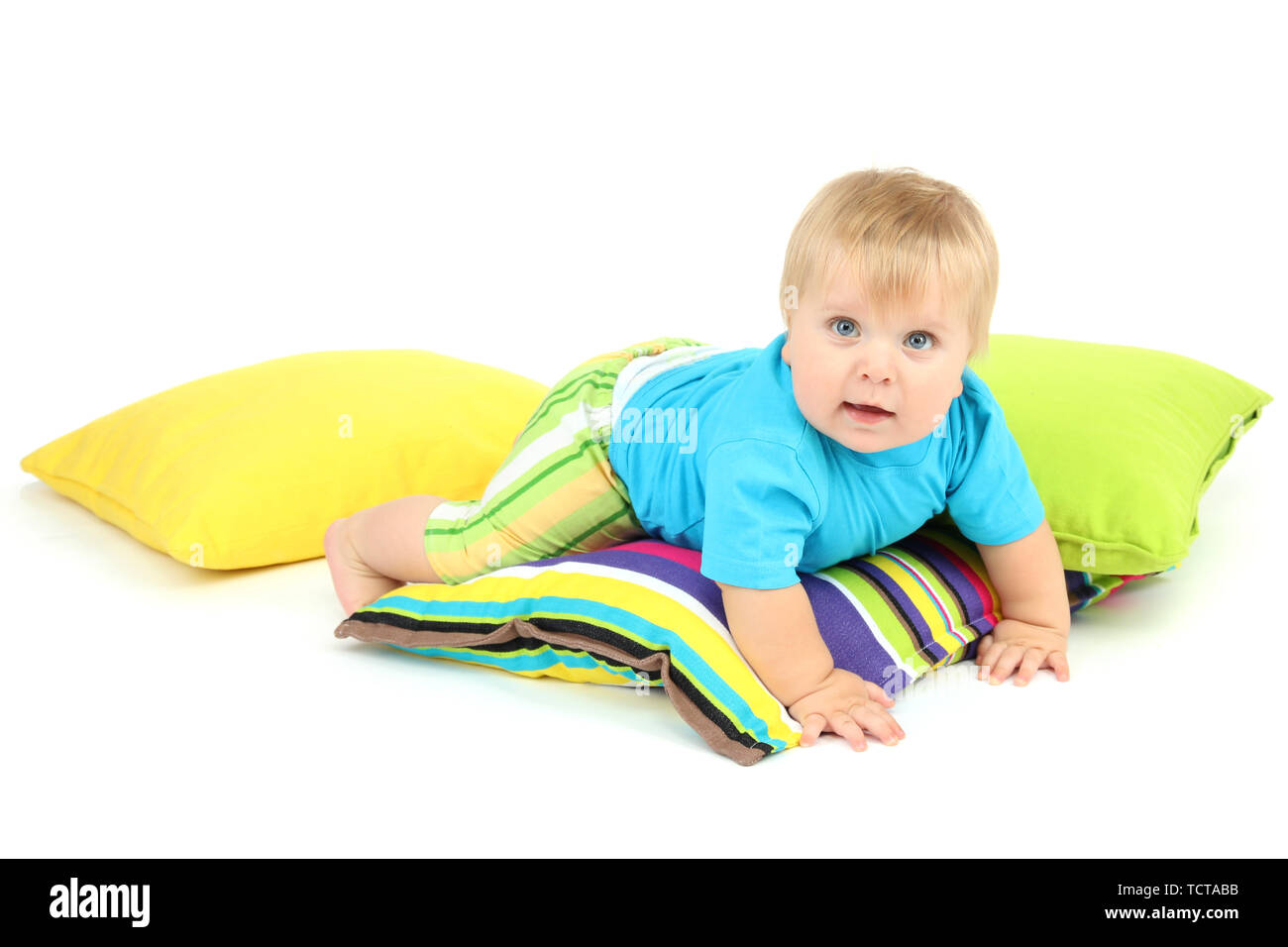 Little boy and color pillows, isolated on white Stock Photo - Alamy