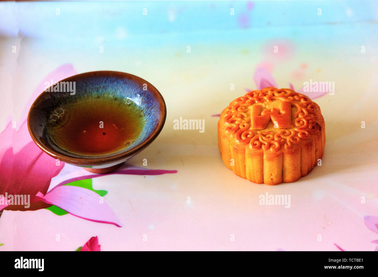 Moon cakes, tea, fruit Stock Photo - Alamy