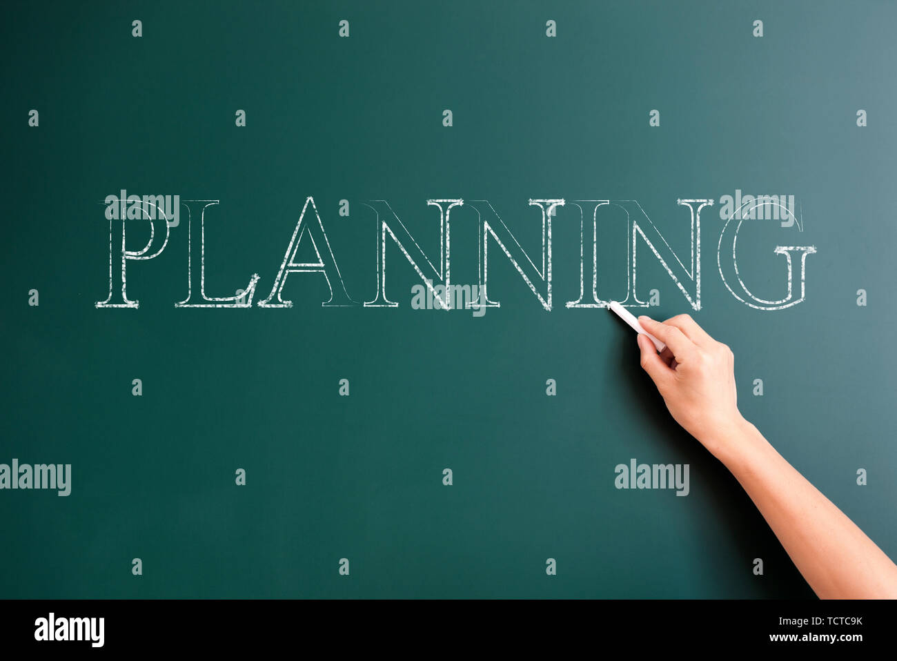Planning written on blackboard Stock Photo - Alamy