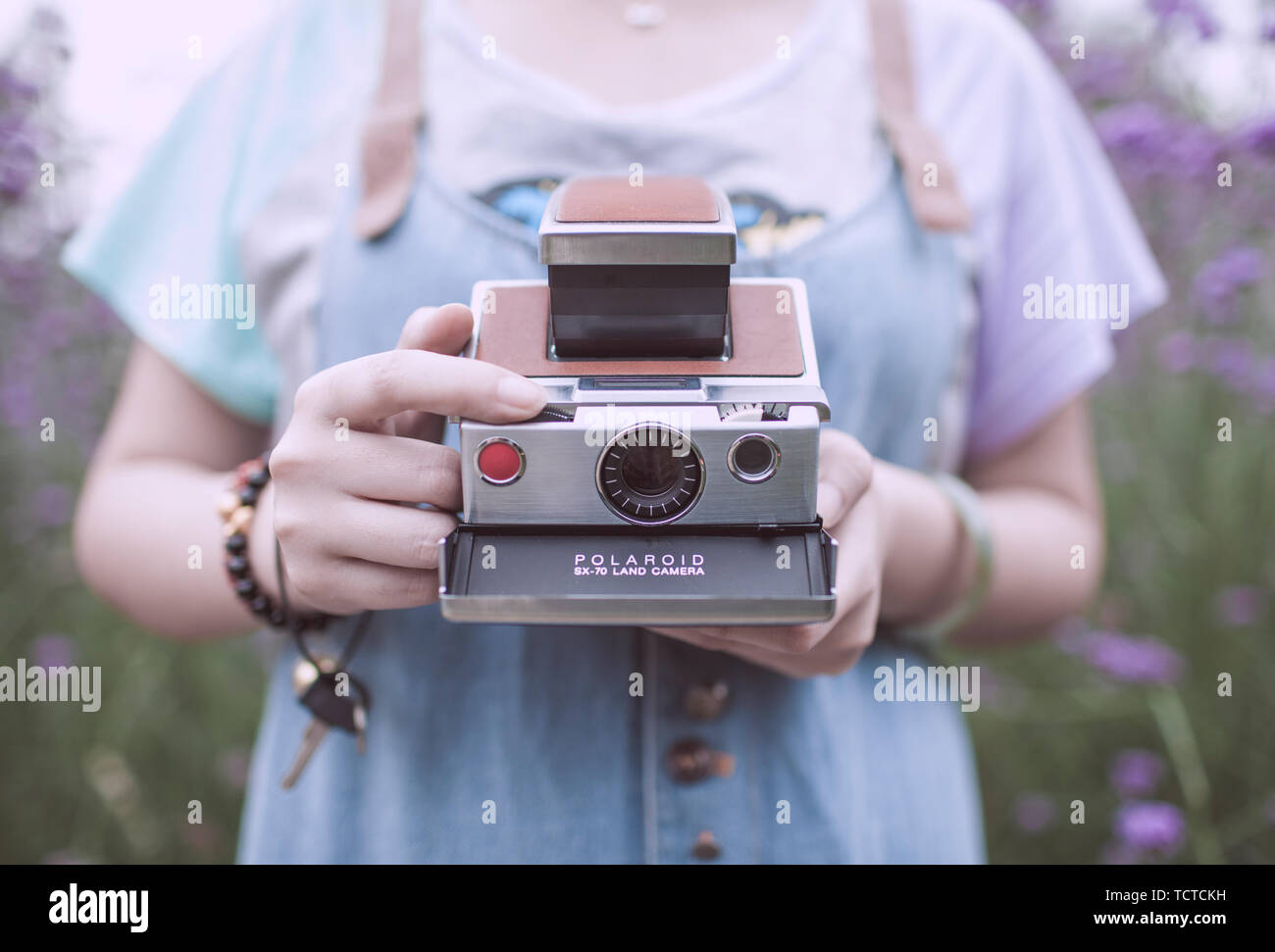 Girl with a camera in hand Stock Photo - Alamy