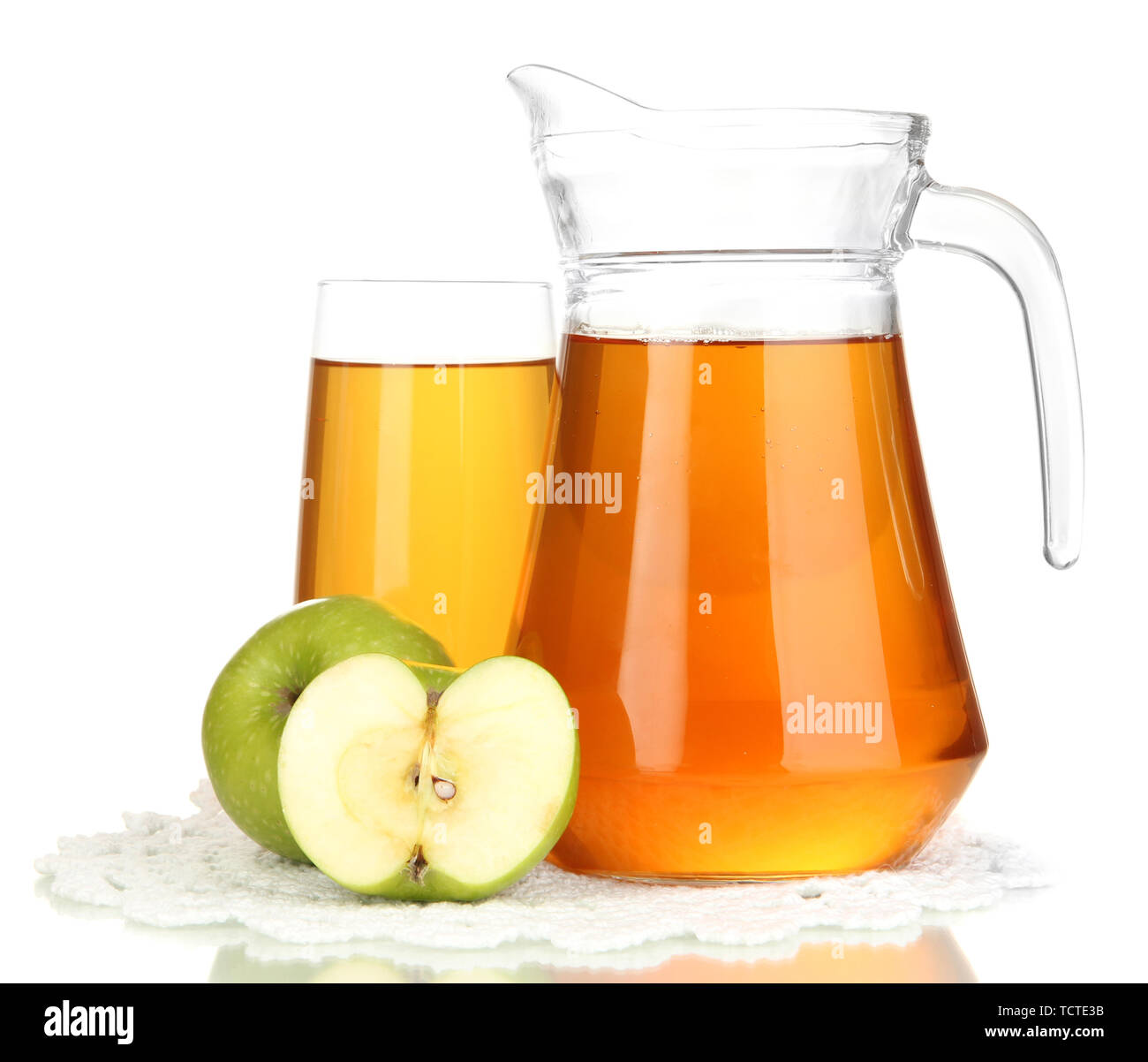 Full glass and jug of apple juice and apples isolted on white Stock ...