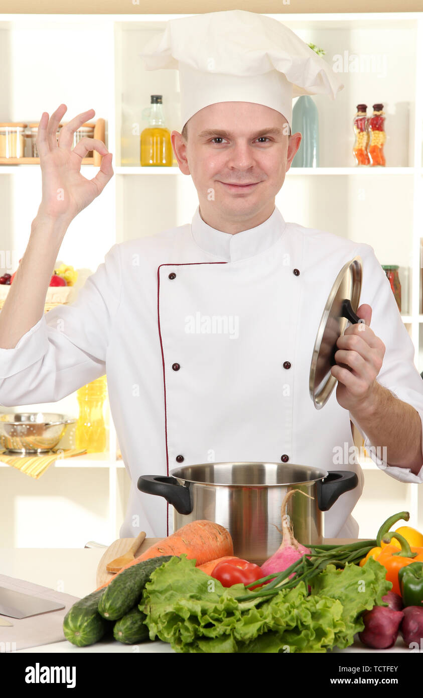 Chef cooking in kitchen Stock Photo - Alamy