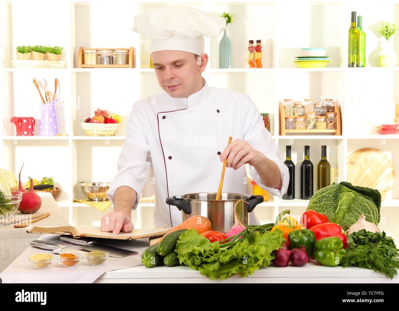 Chef cooking in kitchen Stock Photo - Alamy