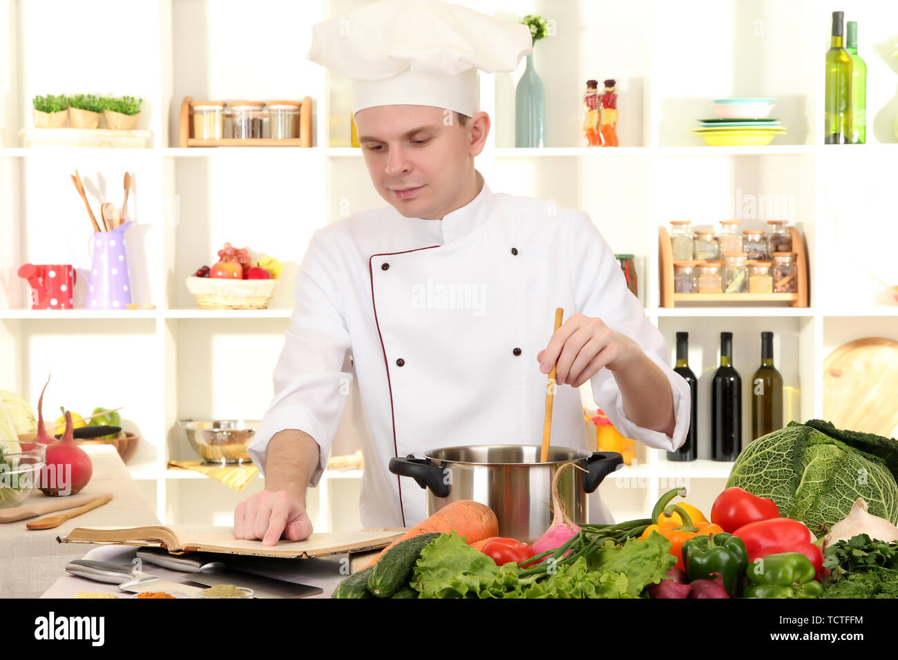 Chef cooking in kitchen Stock Photo - Alamy