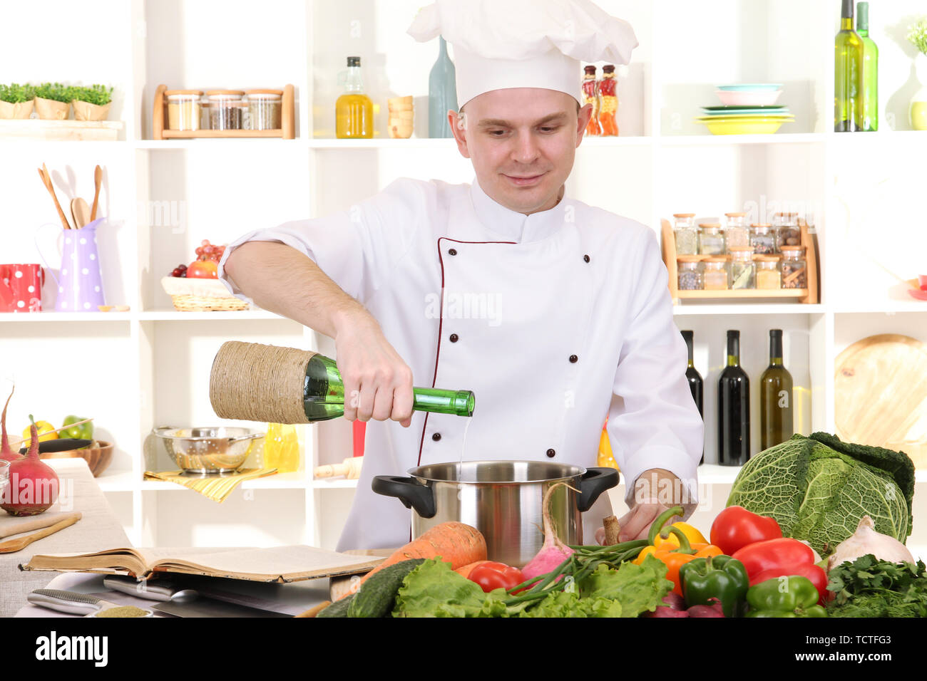 Chef cooking in kitchen Stock Photo - Alamy