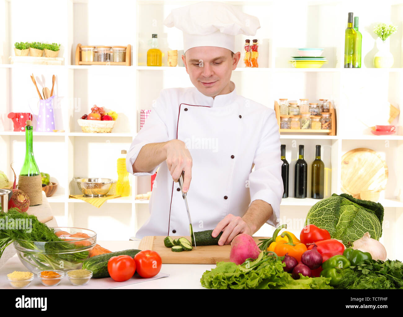 Chef cooking in kitchen Stock Photo - Alamy