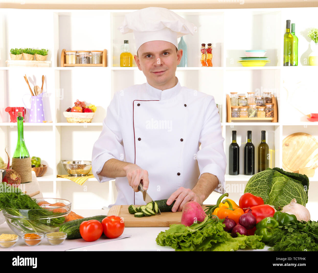 Chef cooking in kitchen Stock Photo - Alamy
