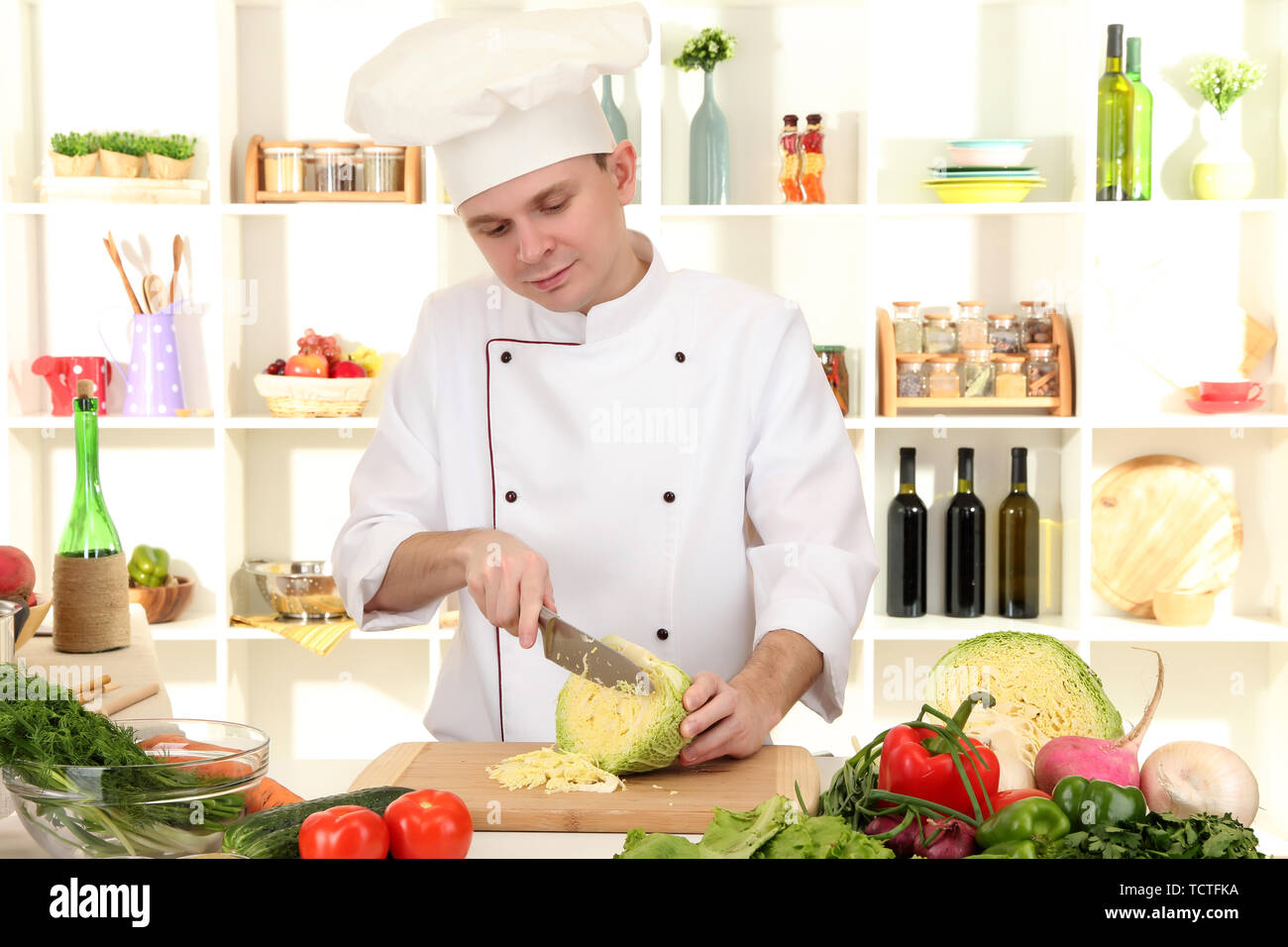 Chef cooking in kitchen Stock Photo - Alamy