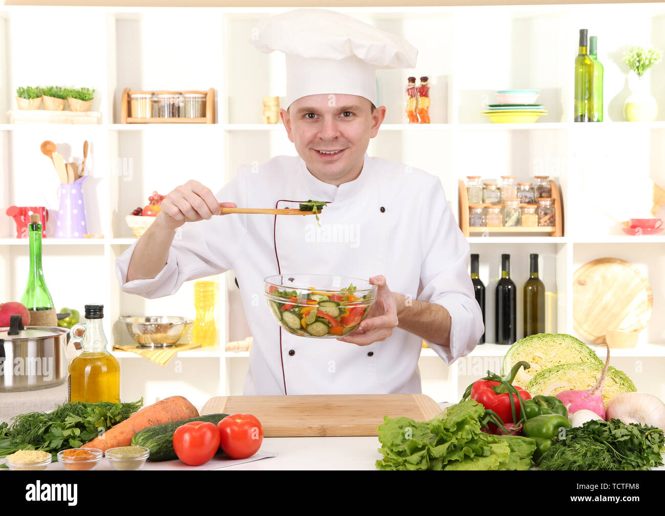 Chef cooking in kitchen Stock Photo - Alamy