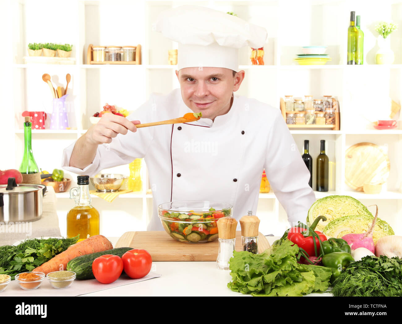 Chef cooking in kitchen Stock Photo - Alamy